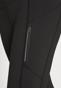 Athleta RAINIER BOOTCUT PANT - Tights - black/schwarz - Zalando.ch