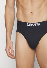 Levi's® MEN SOLID BASIC BRIEF 4 PACK - Slip - black/noir - ZALANDO.FR