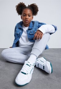 Puma SLIPSTREAM JR UNISEX - Trainers - white/varsity green/white ...