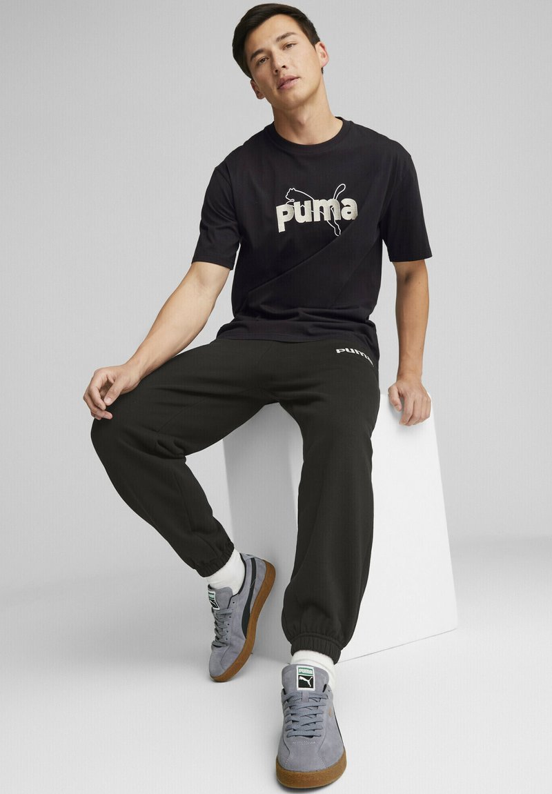 Puma TEAM GRAPHIC TEE - Print T-shirt - black - Zalando