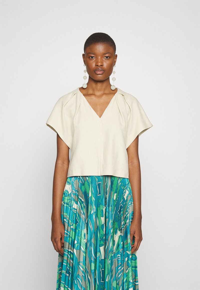 Iro PALIMI - Blouse - light beige/sand - Zalando.de