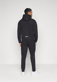 EA7 Emporio Armani NATURAL VENTUS HOODIE - Trainingspak - black/zwart - Zalando.nl