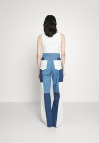 Farm Rio PATCH WIDE PANTS - Relaxed fit jeans - denim blue/multi ...
