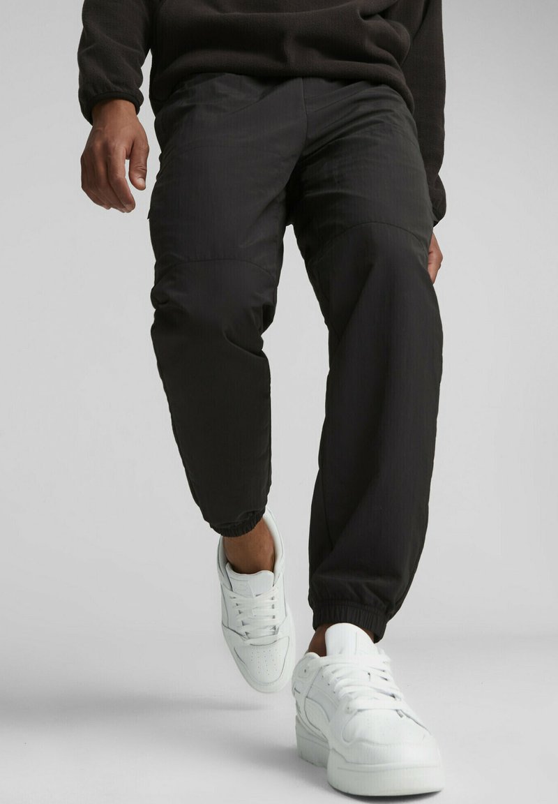 Puma CLASSICS UTILITY - Tracksuit bottoms - black - Zalando.ie