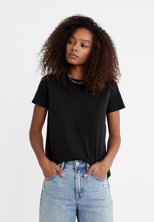 Tops & T-shirts noir | Tous les articles chez Zalando