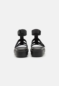 Crocs BROOKLYN LUXE GLADIATOR - Platform sandals - black - Zalando.co.uk