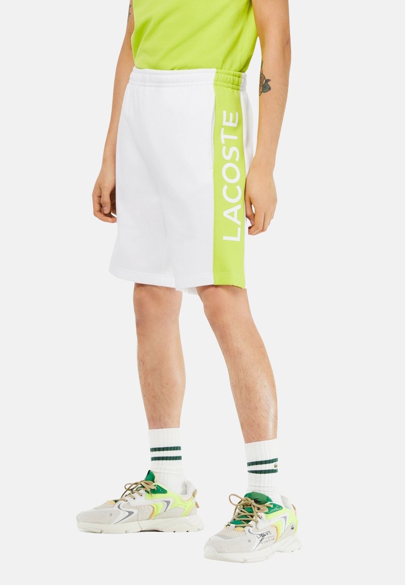 Lacoste IM COLORBLOCK-STYLE MIT TUNNELZUG UN - Tracksuit bottoms - weiß ...