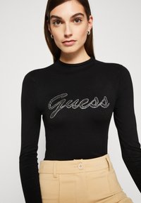 Guess RHINESTONE LOGO - Langarmshirt - jet black/schwarz - Zalando.ch