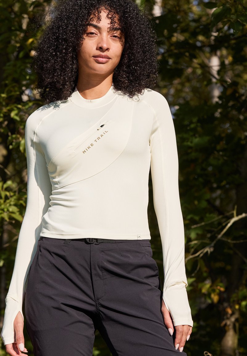 Nike Performance TRAIL - Long sleeved top - pale ivory/khaki/off-white ...