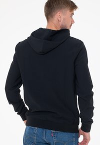 Guess TECH - Sweat à capuche - jet black a/noir - ZALANDO