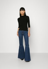 maje MANUCLOVER - Strickpullover - noir/schwarz - Zalando.at