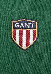 GANT BANNER SHIELD PANTS - Jogginghose - forest green/grün - Zalando.ch