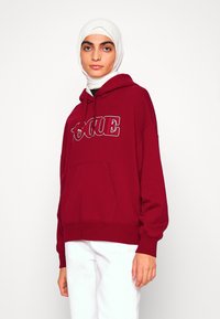 Puma OVERSIZED TR - Jersey con capucha - intense red/rojo - Zalando.es