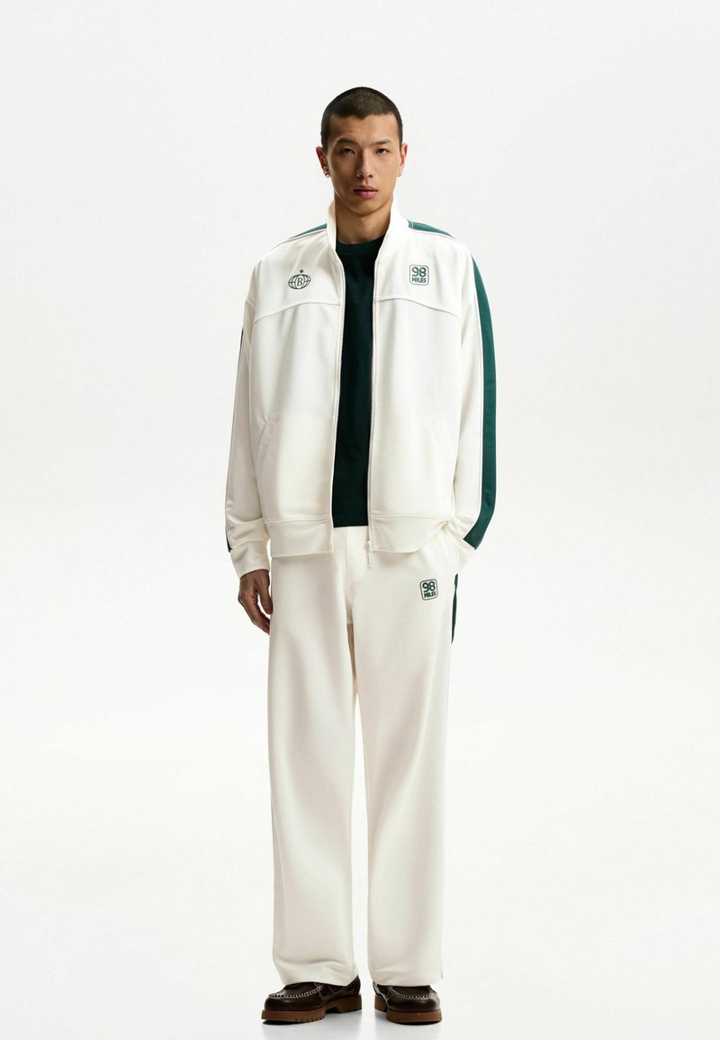Bershka Tracksuit bottoms - white - Zalando.ie