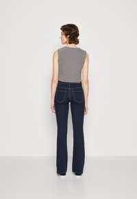 ONLY ONLPAOLA POCKET - Flared Jeans - dark blue denim/donkerblauw - Zalando.nl