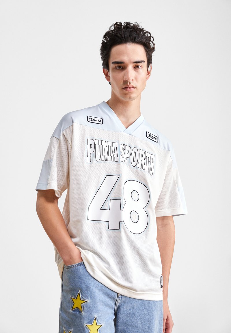 Puma TEAM SPORTS - Print T-shirt - warm white/off-white - Zalando.ie