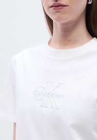 Calvin Klein Jeans MONOLOGO TEE - Print T-shirt - bright white/white ...