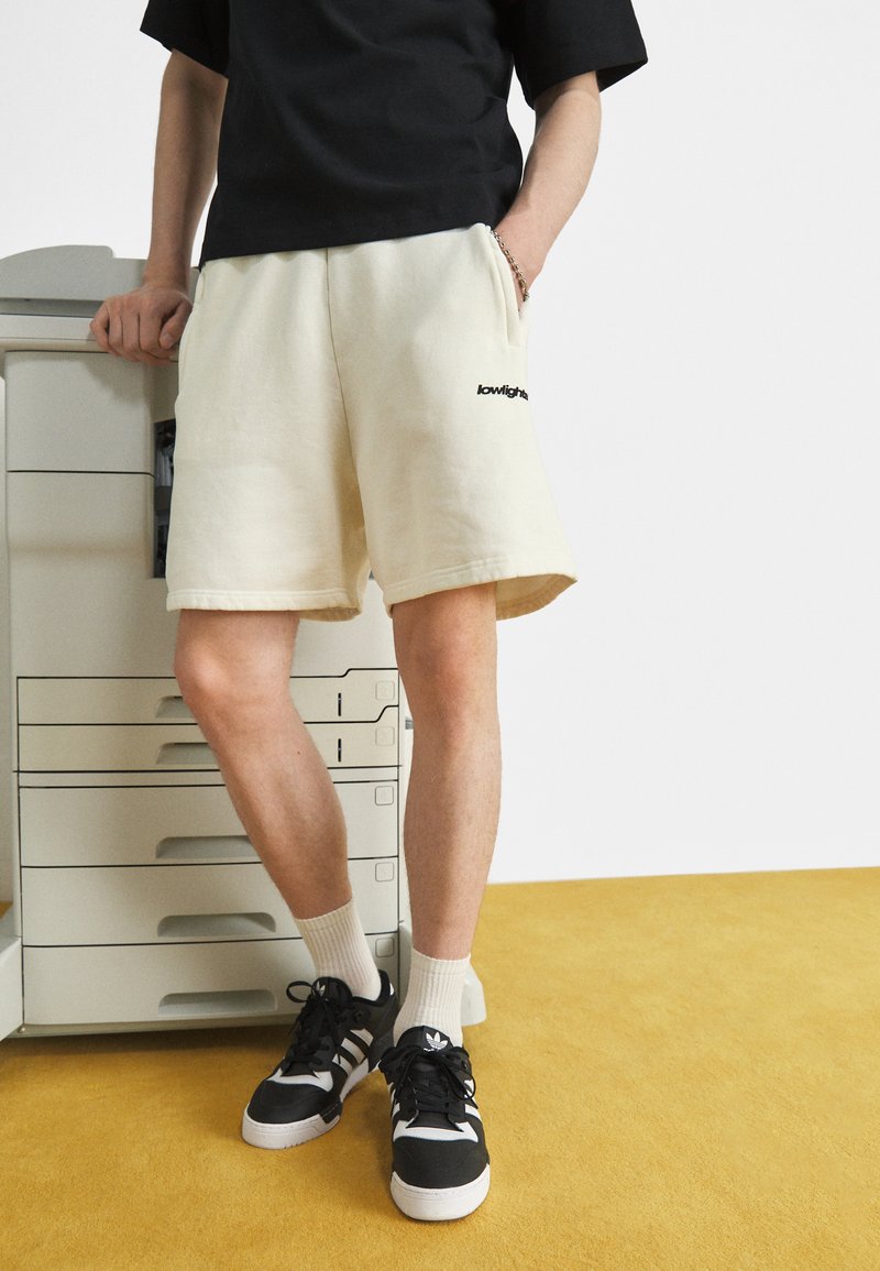 LOW LIGHTS STUDIOS® LIGHT UNISEX - Tracksuit bottoms - ecru/off-white ...