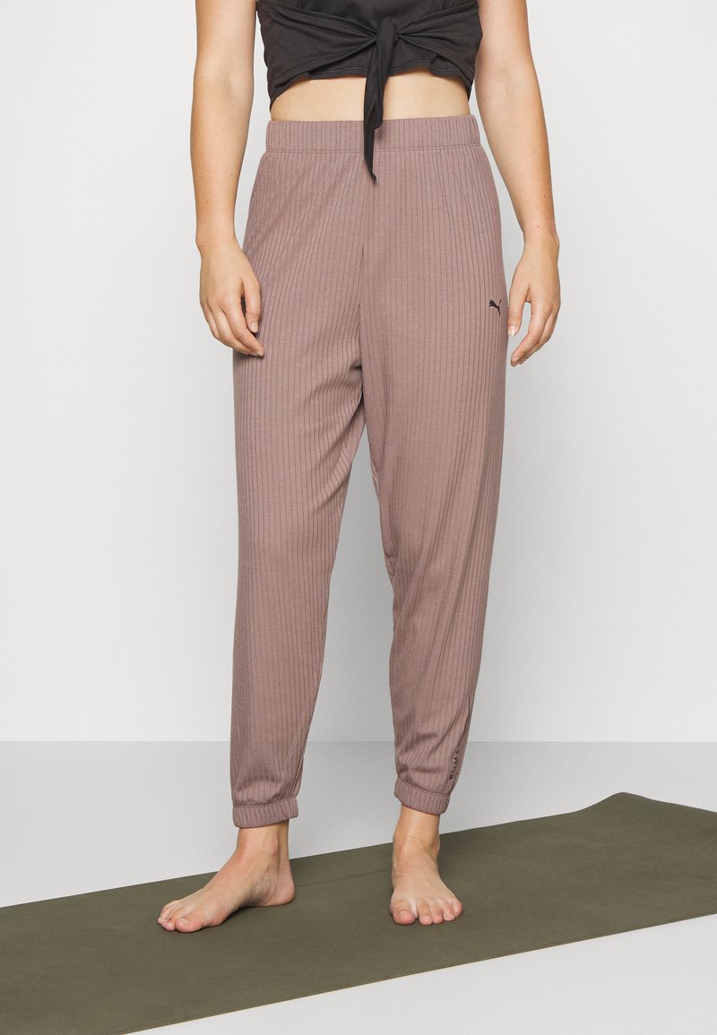 Puma STUDIO UNWIND JOGGER - Tracksuit bottoms - dark clove/pink ...