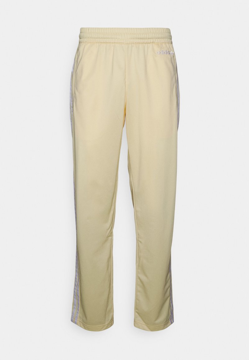 adidas Originals STRAIGHT TP - Tracksuit bottoms - easy yellow/light ...