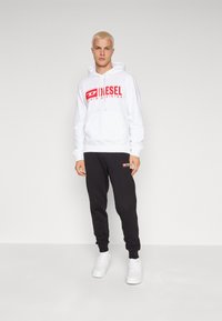 Diesel Tracksuit bottoms - black - Zalando.co.uk