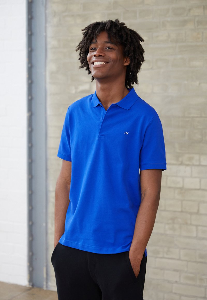 Calvin Klein STRETCH SLIM - Polo shirt - mid azure blue/royal blue ...