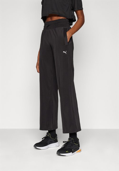 Puma MODEST ACTIVEWEAR WIDE LEG PANT - Jogginghose - black/schwarz ...