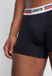 Levi's® MEN PLACED LOGO BOXER BRIEF 4 PACK - Úzke boxerky - black ...