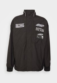 Puma GARAGE CREW - Overgangsjakke - black/sort - Zalando.dk