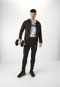 Puma EVOSTRIPE - Pantalon de survêtement - black/noir - ZALANDO.FR