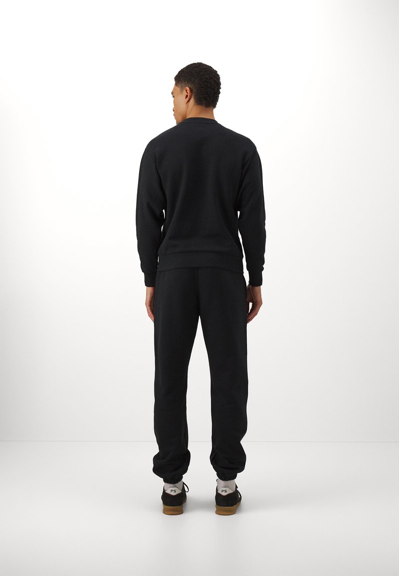 7 DAYS Active ORGANIC PANTS UNISEX - Jogginghose - black/schwarz ...