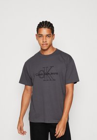 Calvin Klein Jeans MONOLOGO WASHED TEE UNISEX - T-Shirt print - washed black/schwarz - Zalando.de
