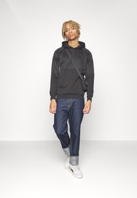 Puma TECH FL - Jersey con capucha - black/negro - Zalando.es