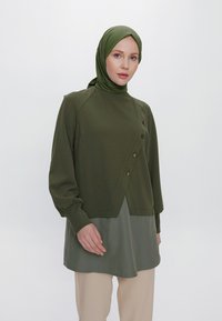 Armine MODEST FRONT ZIPPER CUP DETAILED BELTED COAT - Blouse - khaki ...