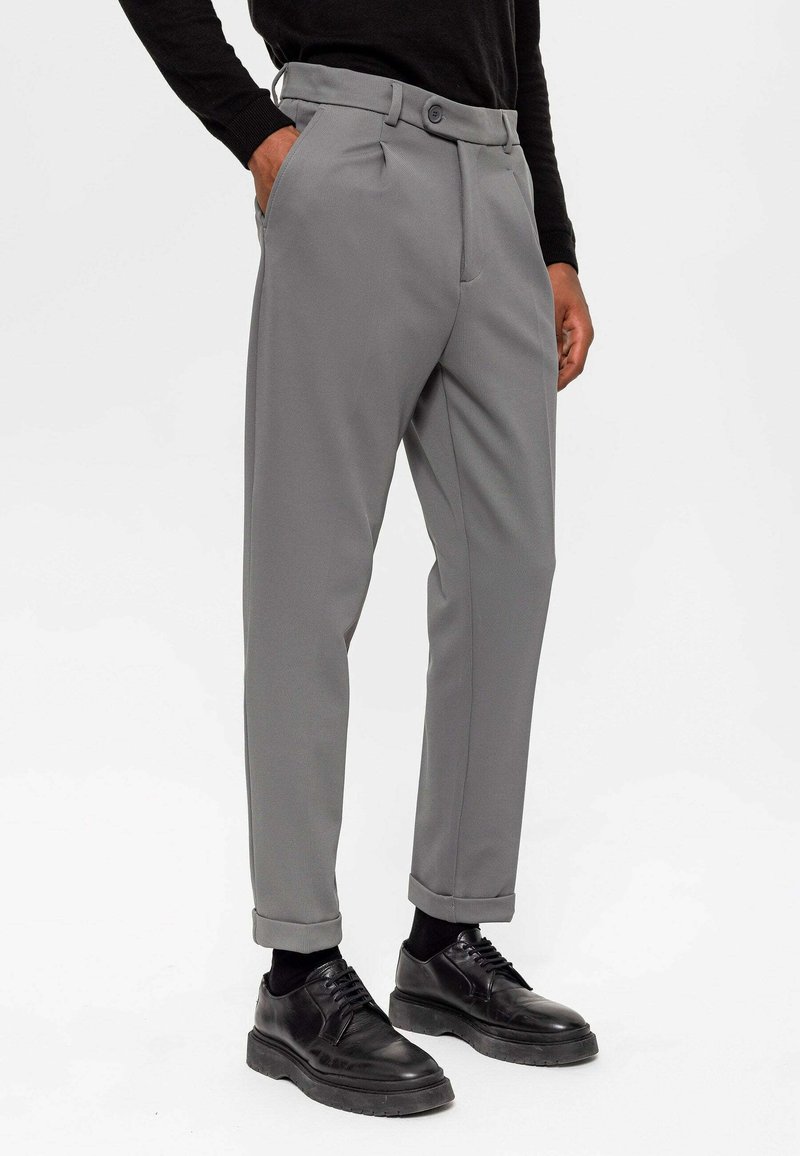 Antioch Trousers - smoked/mustard yellow - Zalando