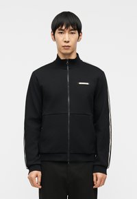 EA7 Emporio Armani TRAIN LOGO SERIES TAPE UNISEX - Bluză de molton cu fermoar - black/negru ...