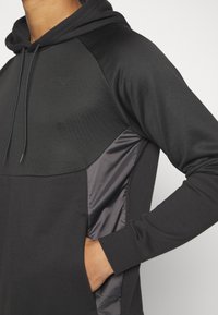 Puma TECH FL - Jersey con capucha - black/negro - Zalando.es