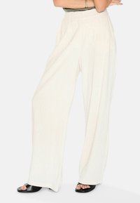 Moves ANDRIANA - Trousers - castle wall/beige - Zalando.ie