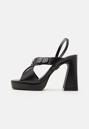 Koi Footwear ROTTEN MINDS BUCKLE PLATFORM - Platform sandals - black ...
