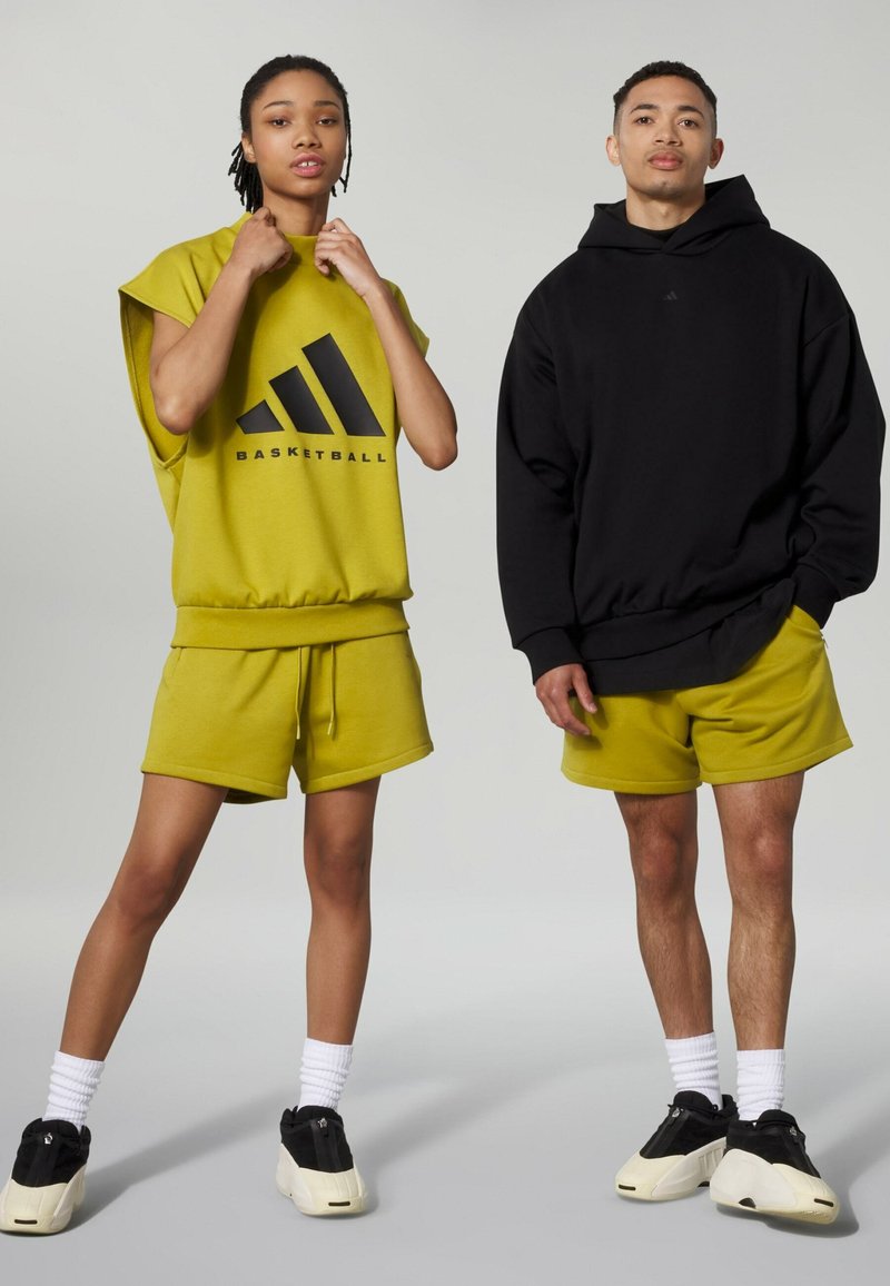 adidas Originals ONE - Tracksuit bottoms - pulse olive/yellow - Zalando ...