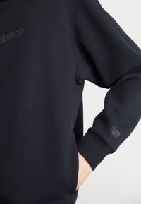 New Balance SHIFTED GRAPHIC HOODIE - Sweatshirt - black - Zalando.co.uk