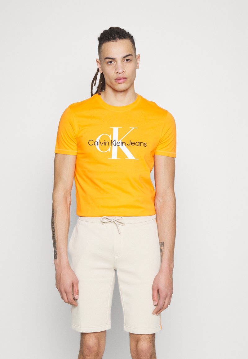 Calvin Klein Jeans SEASONAL MONOLOGO TEE - T-Shirt print - vibrant orange/orange - Zalando.ch