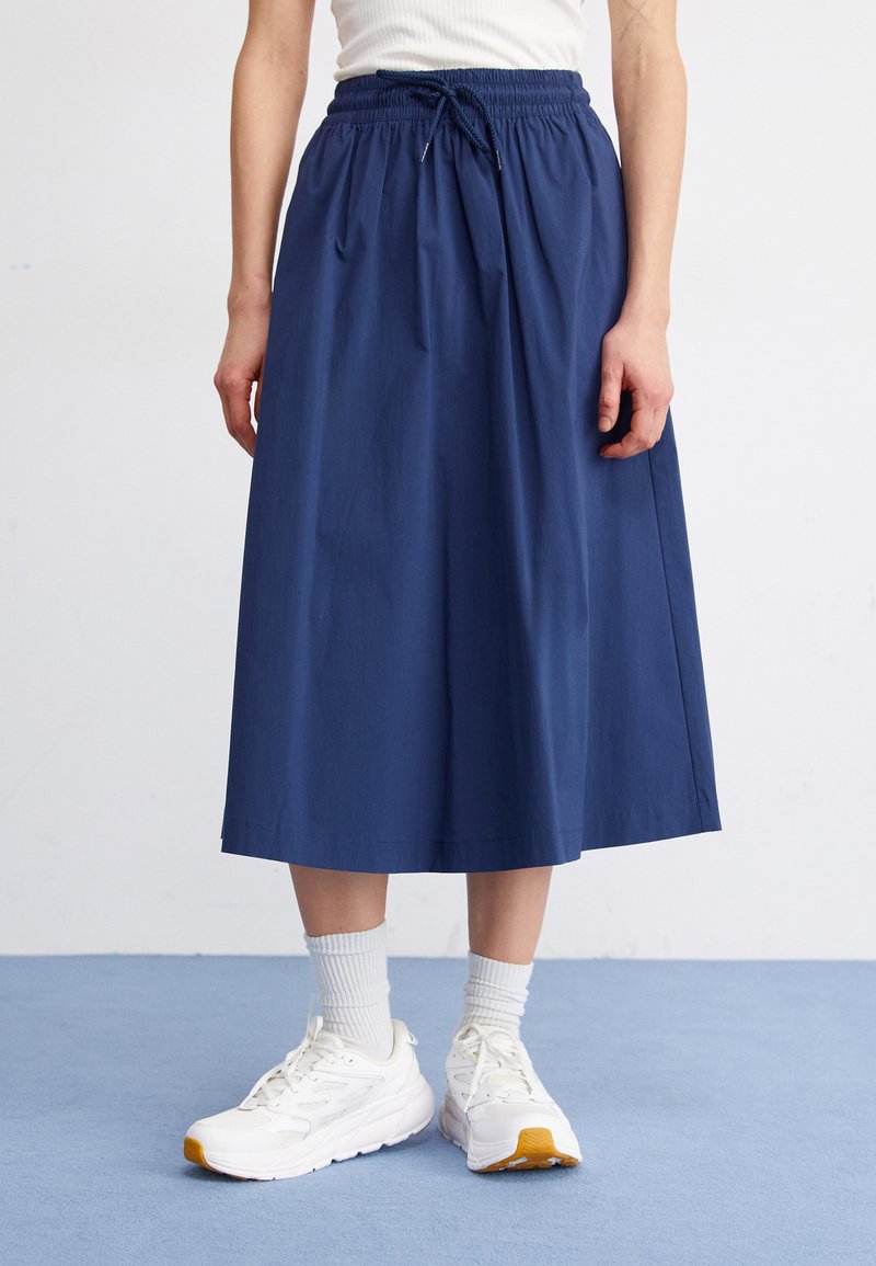 New Balance SPORTSWEARS GREATEST HITS SKIRT - A-lijn rok - navy/blauw ...
