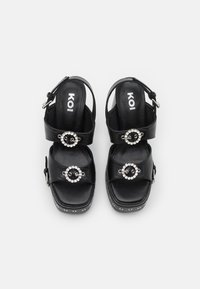 Koi Footwear ROTTEN MINDS BUCKLE PLATFORM - Platform sandals - black ...