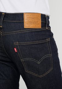 Levi's® 502 REGULAR TAPER - Jeans Tapered Fit - rock cod/dark-blue ...