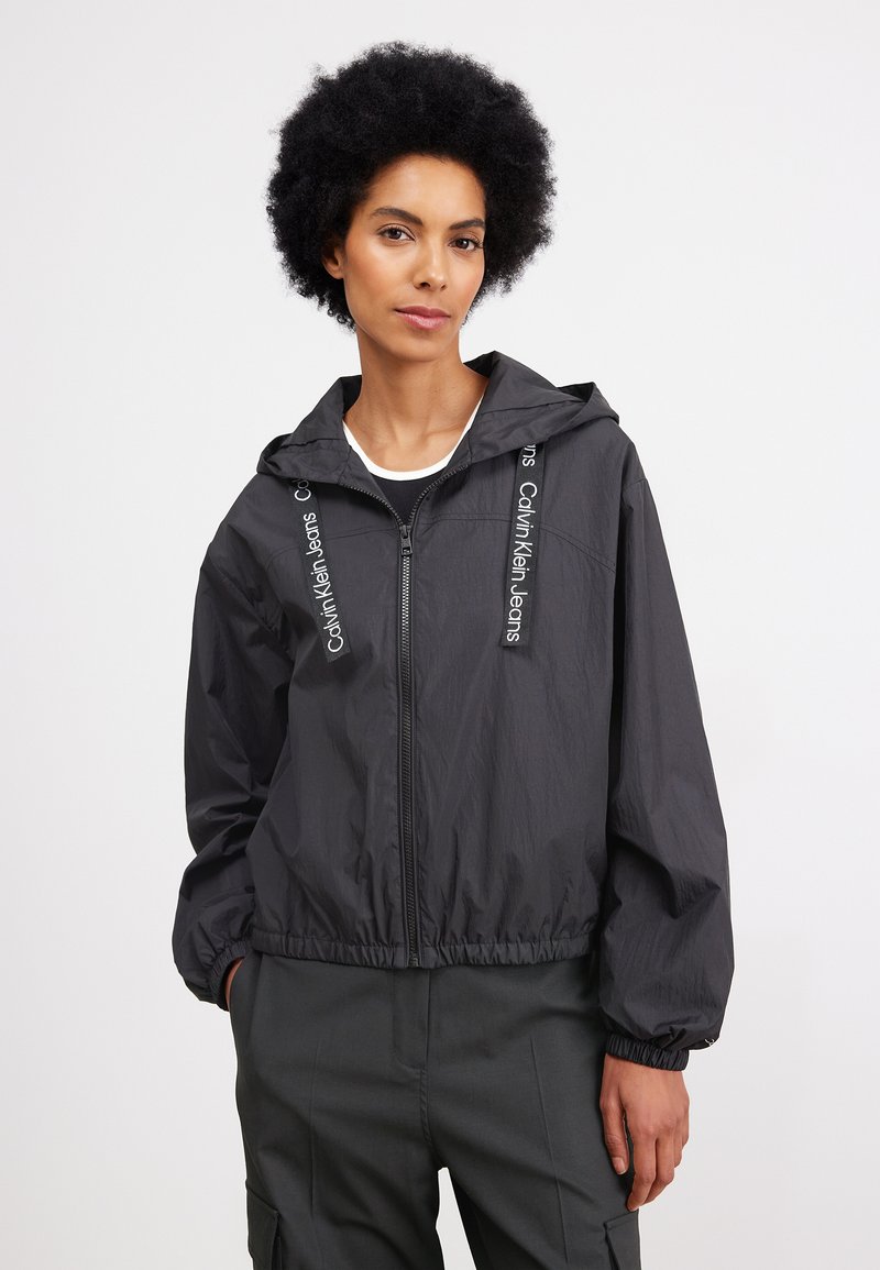 Calvin Klein Jeans LOGO DRAWSTRING WINDBREAKER - Bomber Jacket - ck ...