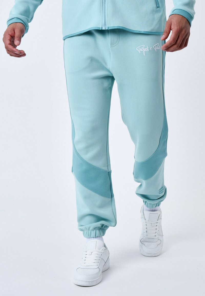 Project X Paris JOGGING TWO TONE - Tracksuit bottoms - cyan/neon blue ...