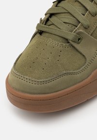 Puma SLIPSTREAM UNISEX - Trainers - dark green moss/mottled olive ...