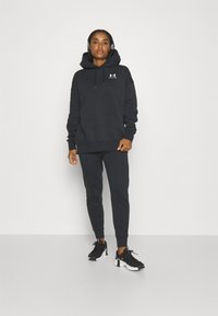 Under Armour RIVAL - Jogginghose - black/white/schwarz - Zalando.ch