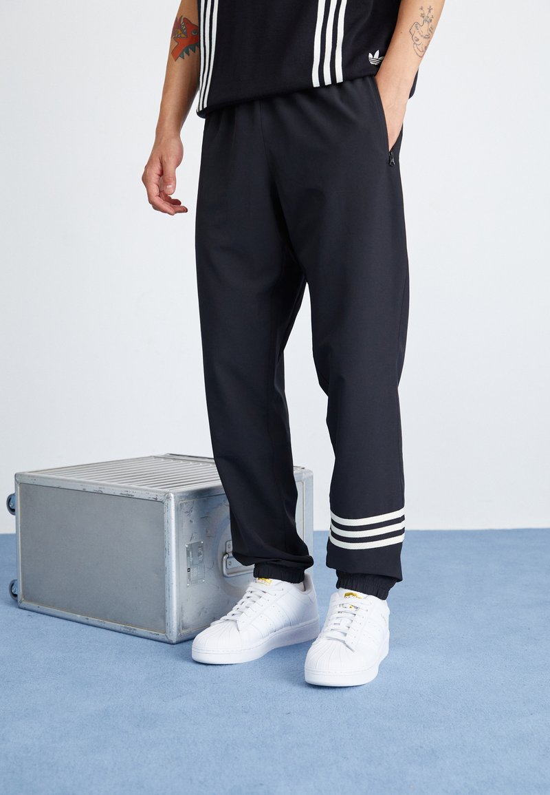 adidas Originals ADICOLOR NEUCLASSICS - Tracksuit bottoms - black - Zalando.co.uk